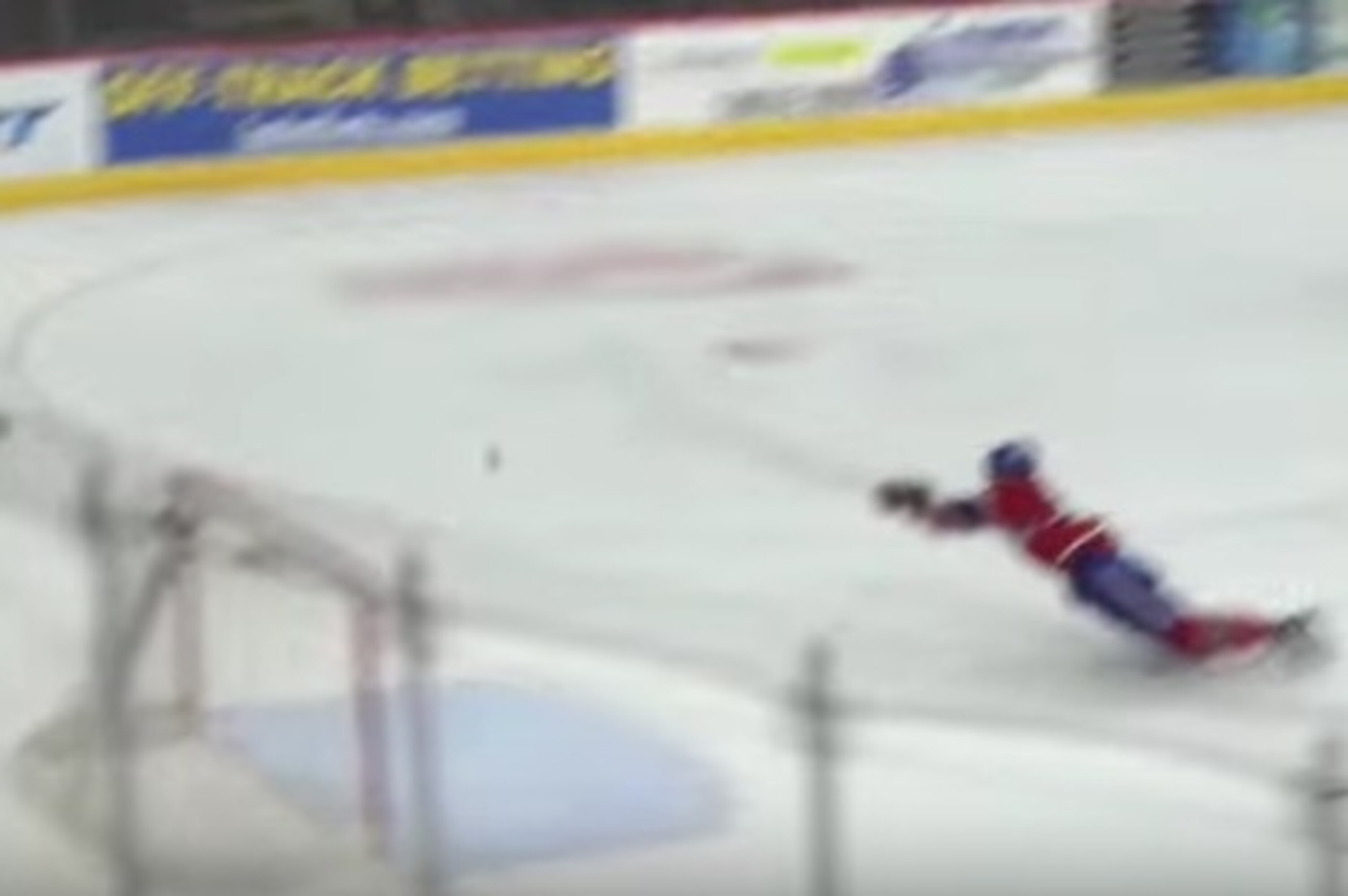 AHL Player Makes Ridiculous Diving Save to Prevent Empty-Net Goal